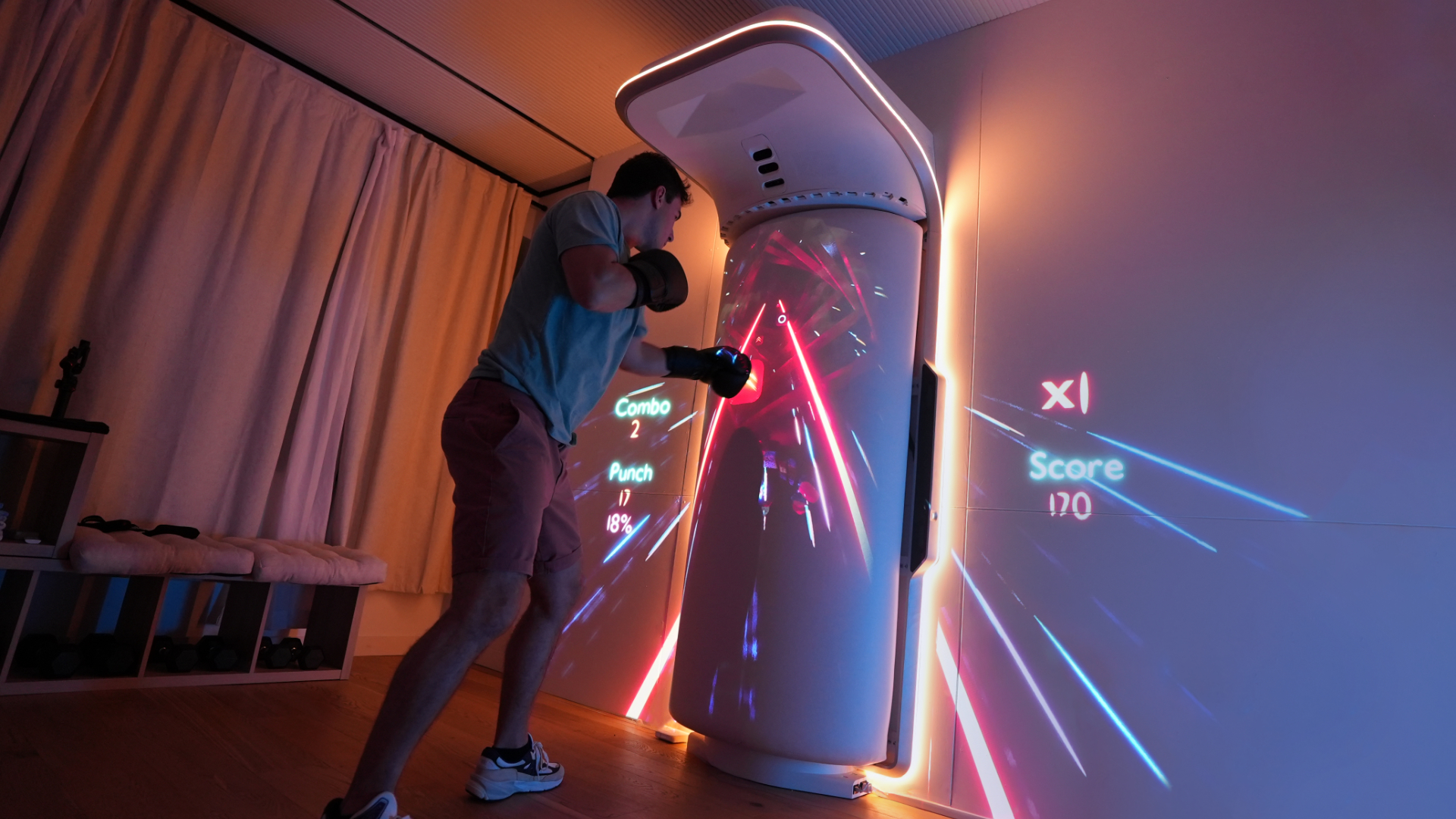 This AI-controlled punching bag projects a life-size fitness coach into ...